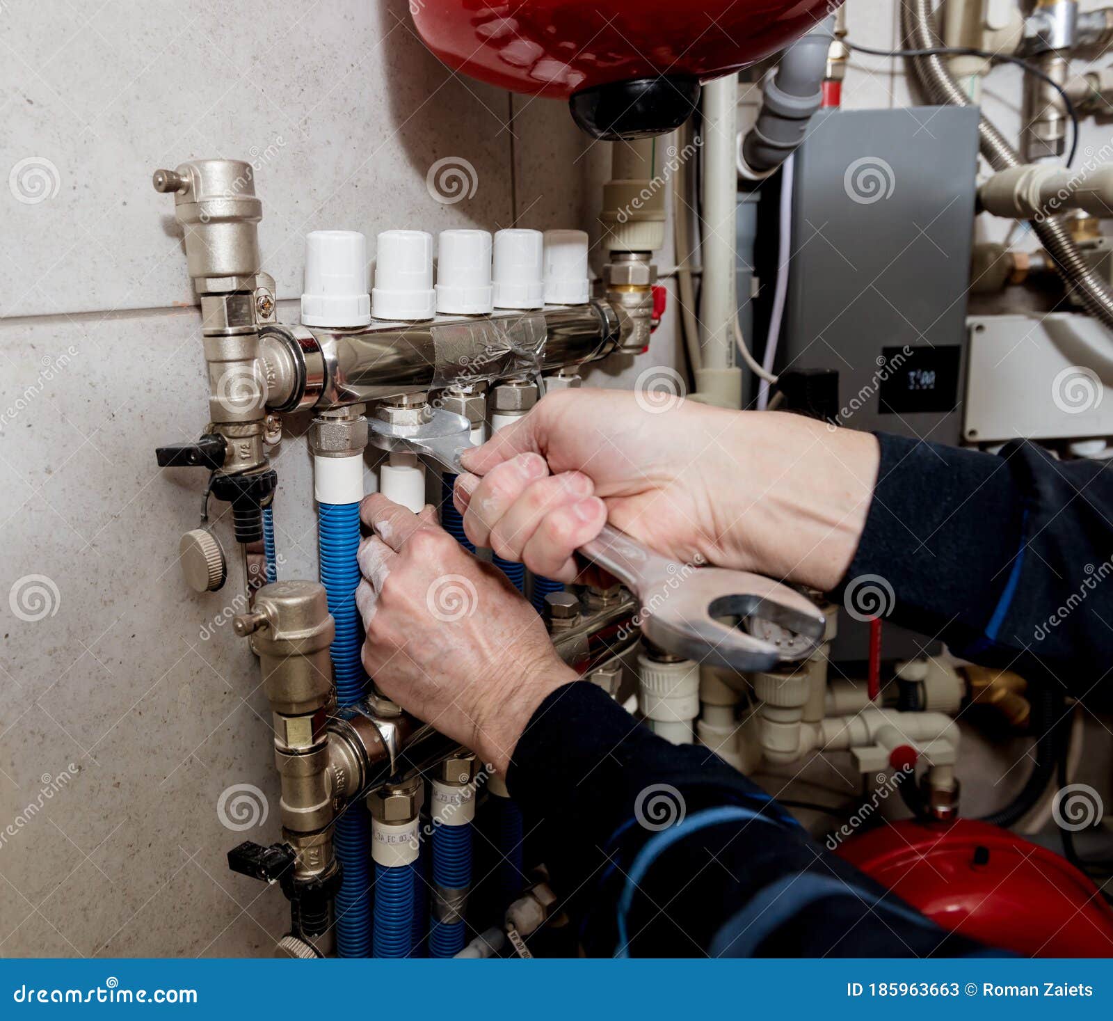 Heating Engineer Installing Modern Heating System in Boiler Room. Stock ...