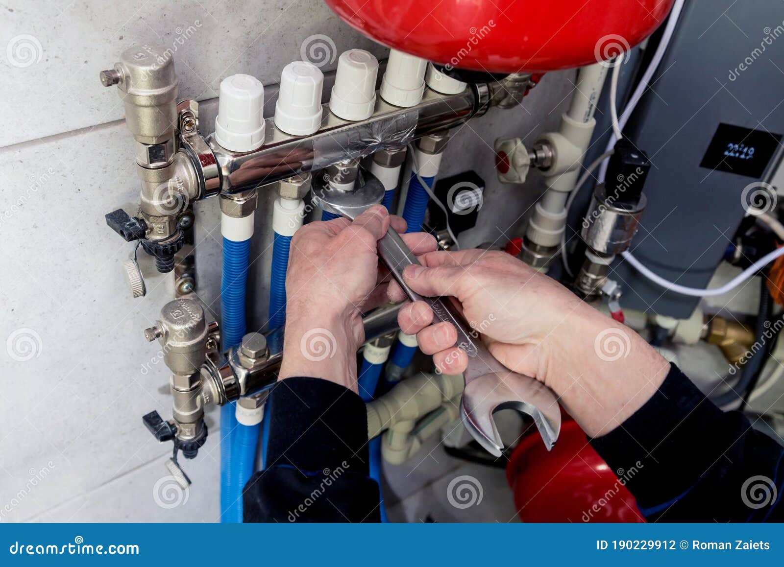 Heating Engineer Installing Modern Heating System in Boiler Room. Stock ...
