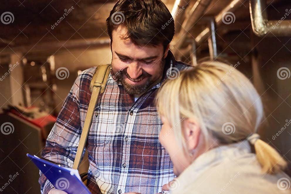 Heating Installer Talking To a Customer Stock Photo - Image of energy ...