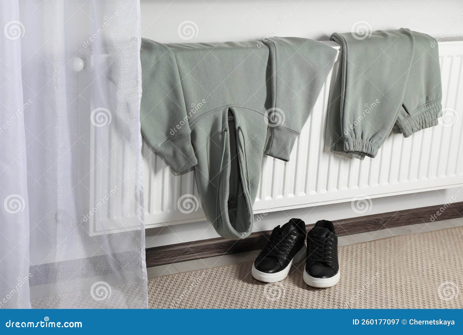 Heating Radiator with Clothes and Shoes in Room Stock Image - Image of ...