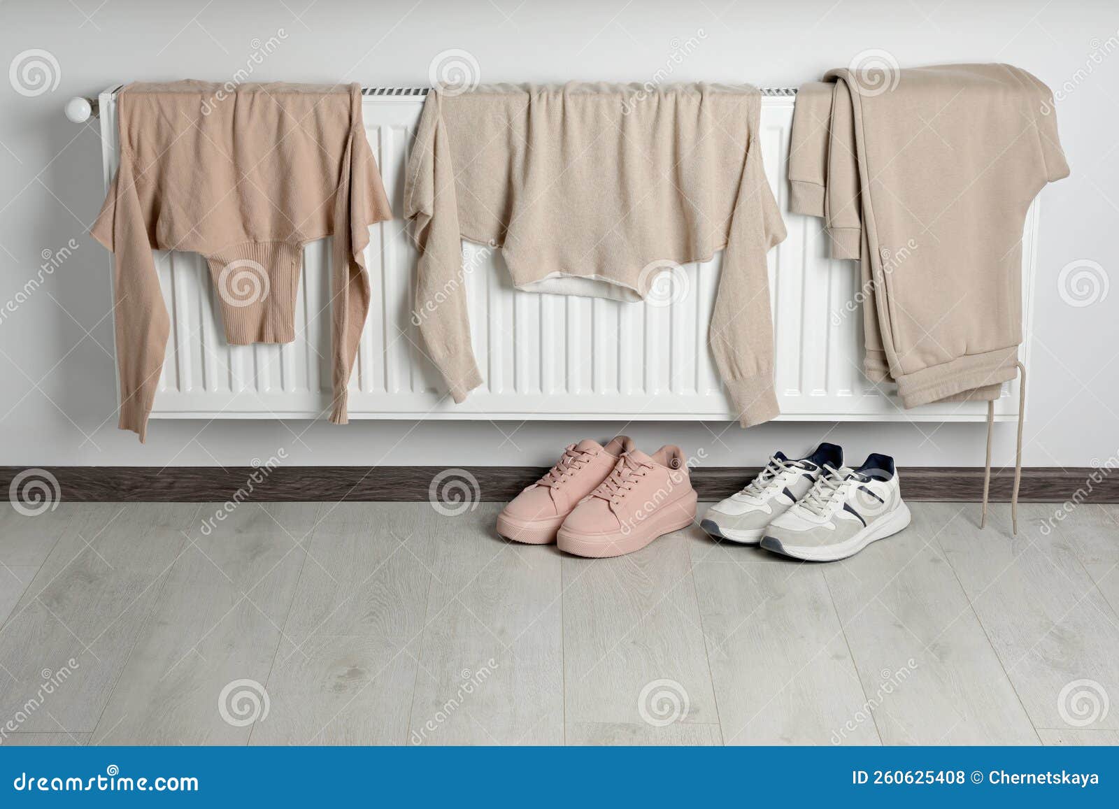 Heating Radiator with Clothes and Shoes in Room Stock Photo - Image of ...