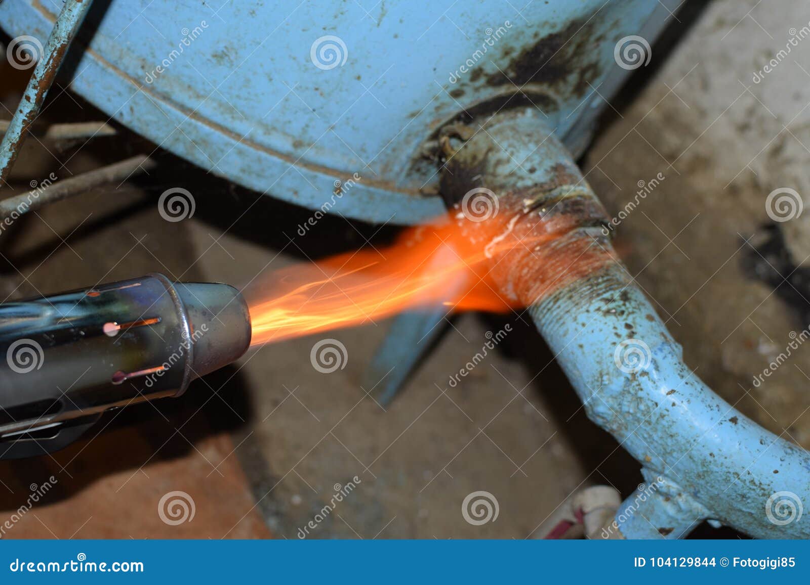 Heating a Steel Pipe with a Blowtorch. the Flame of a Blowtorch Stock ...