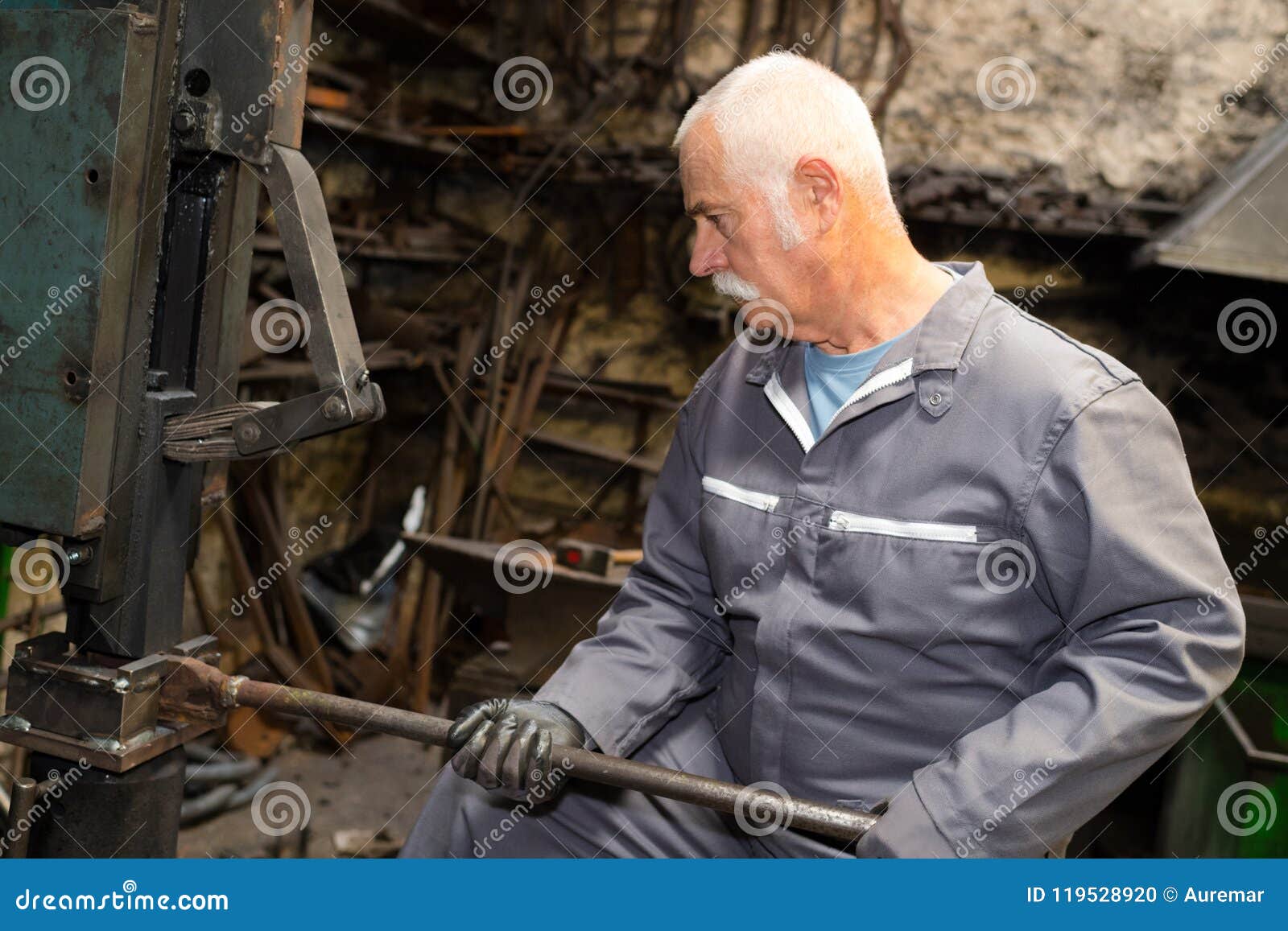 Heating a steel rod stock photo. Image of laborer, steel - 119528920