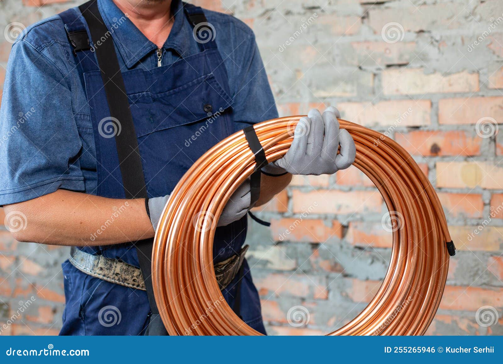 Heating Red Electrical Cable in Hands of Male Electrician Technician ...