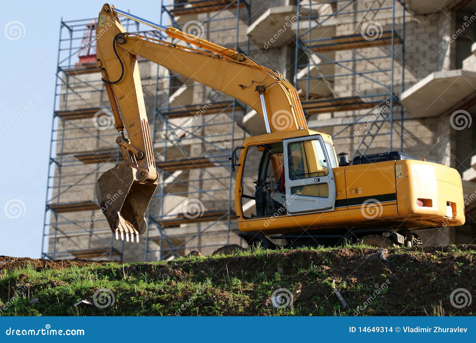 Heavy Buildind Tractor in Front of Building Site Stock Photo - Image of ...
