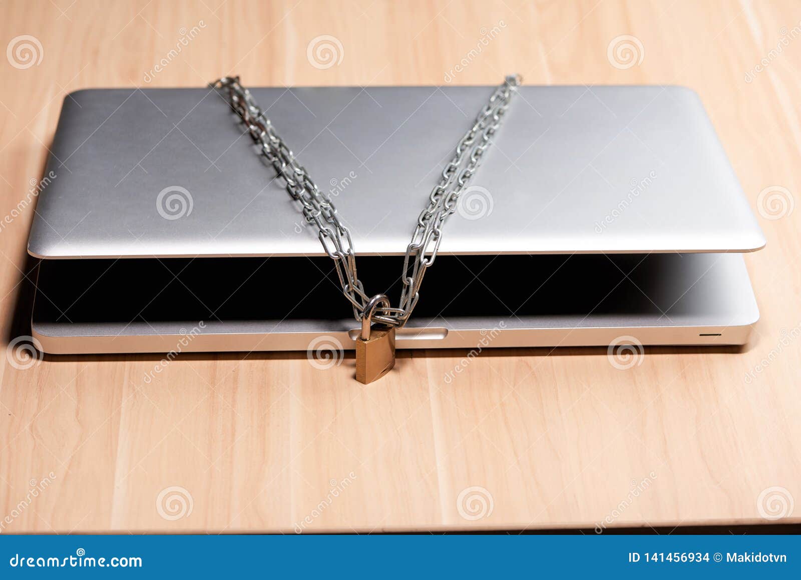 Heavy Chain with a Padlock Around a Laptop on Table Stock Photo - Image ...
