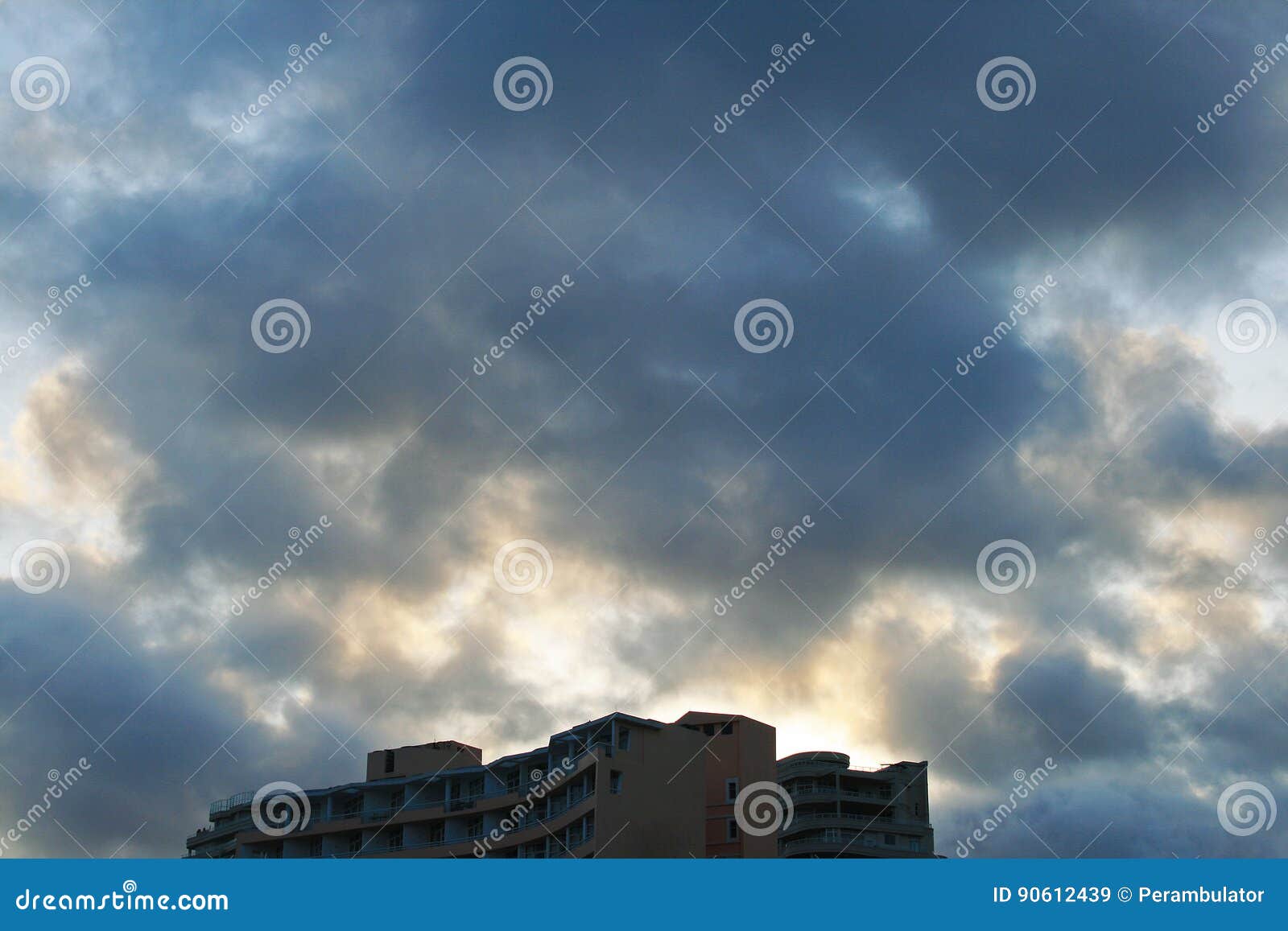 HEAVY CLOUD OVER BUILDING stock image. Image of gold - 90612439