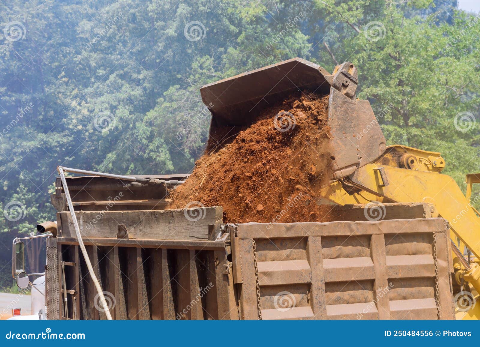 Heavy Construction Equipment Load Earth into Dump Truck Using ...