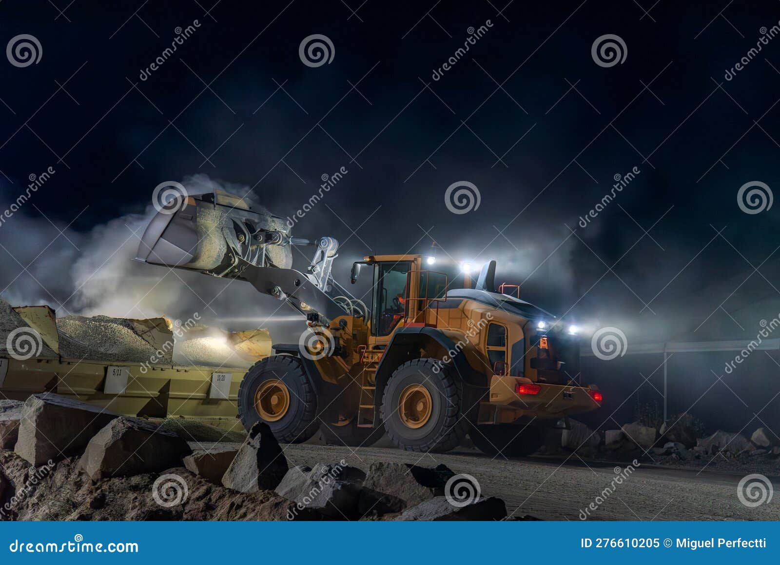 Heavy Construction and Mining Machinery Unloading Gravel into Silos on ...