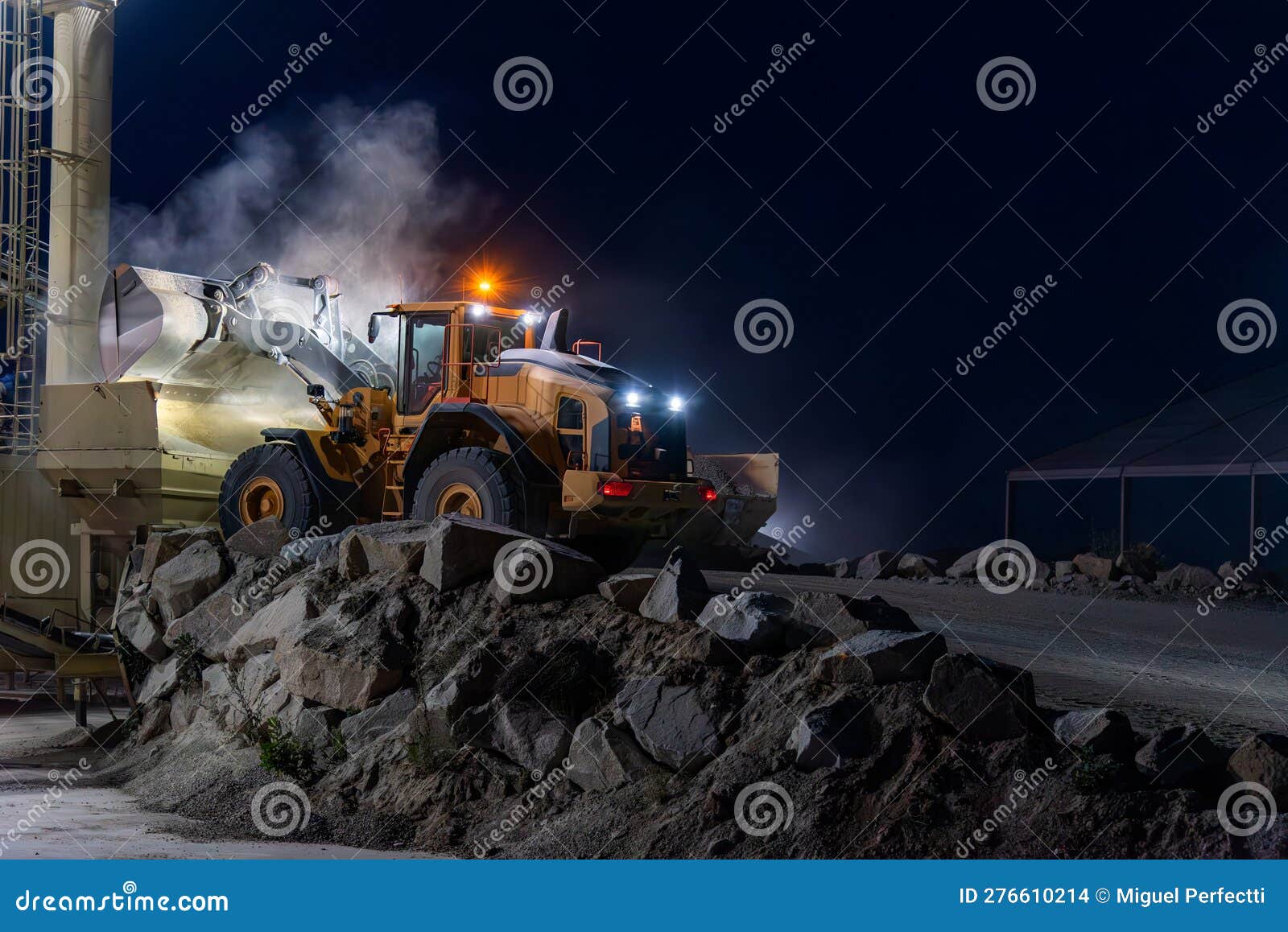 Heavy Construction and Mining Machinery Unloading Gravel into Silos on ...