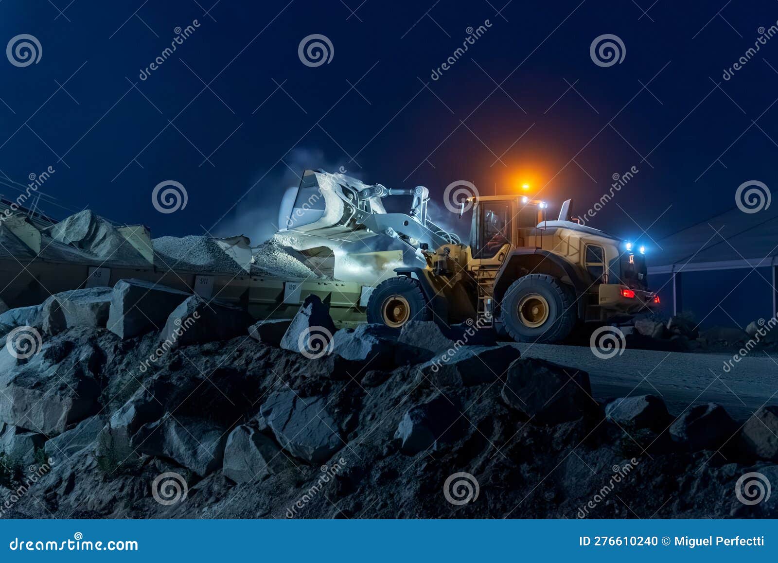 Heavy Construction and Mining Machinery Unloading Gravel into Silos on ...