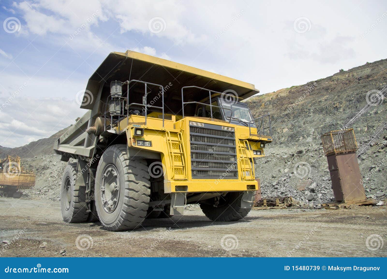 Heavy Dump Trucks And Hydraulic Luffing Jib Tower Cranes Works At A ...