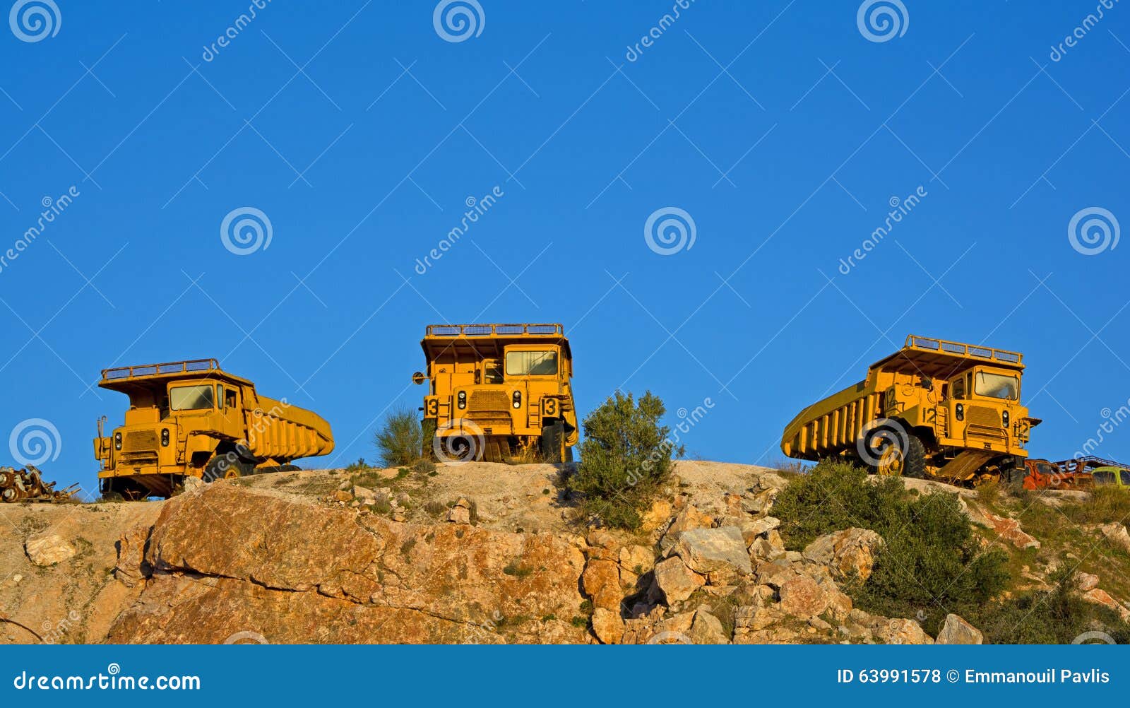 Dump Trucks Unloading Garbage Over Vast Landfill. Smoking Industrial ...