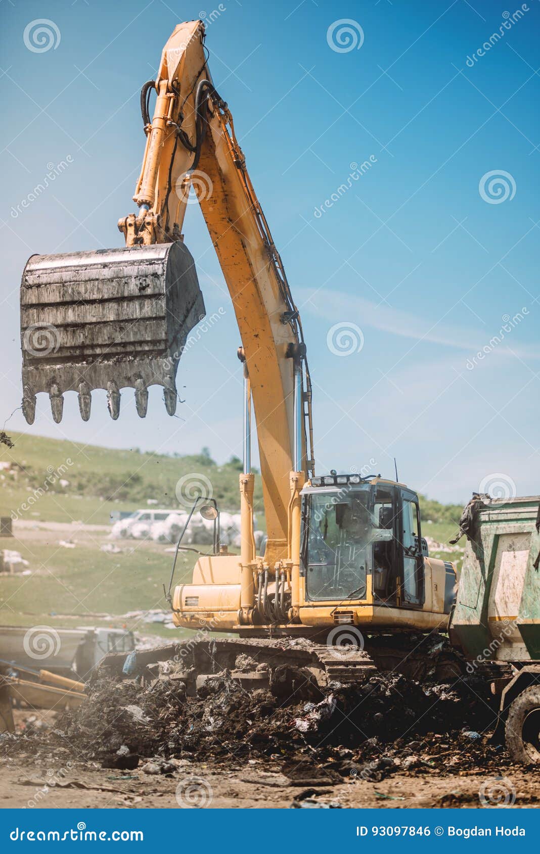 Heavy Duty Machinery Working on Site. Excavator Loading Dumper Trucks ...