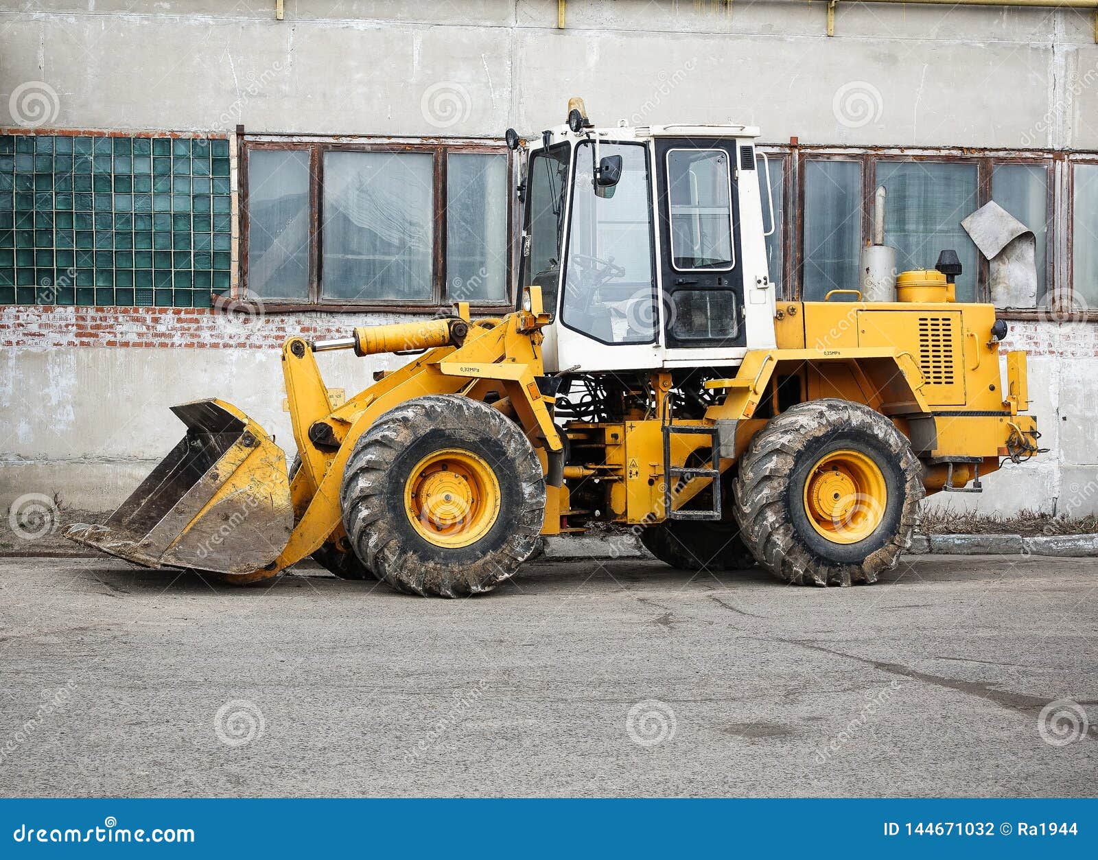 Heavy-duty Wheel Dozer Loader on the Background of Industrial Landscape ...