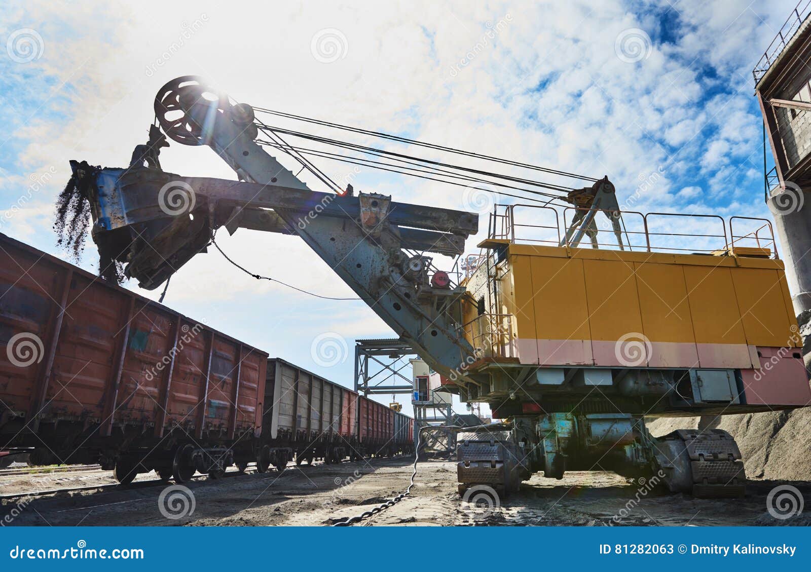 Heavy Excavator Loading Gravel into Train for Rail Freightage Stock ...