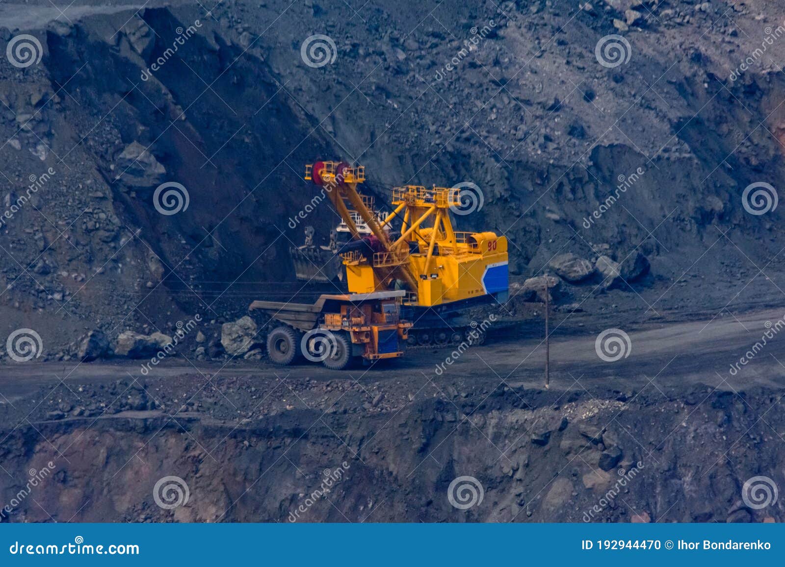 Heavy Excavator Loading Huge Dump Truck with Iron Ore in the Quarry ...