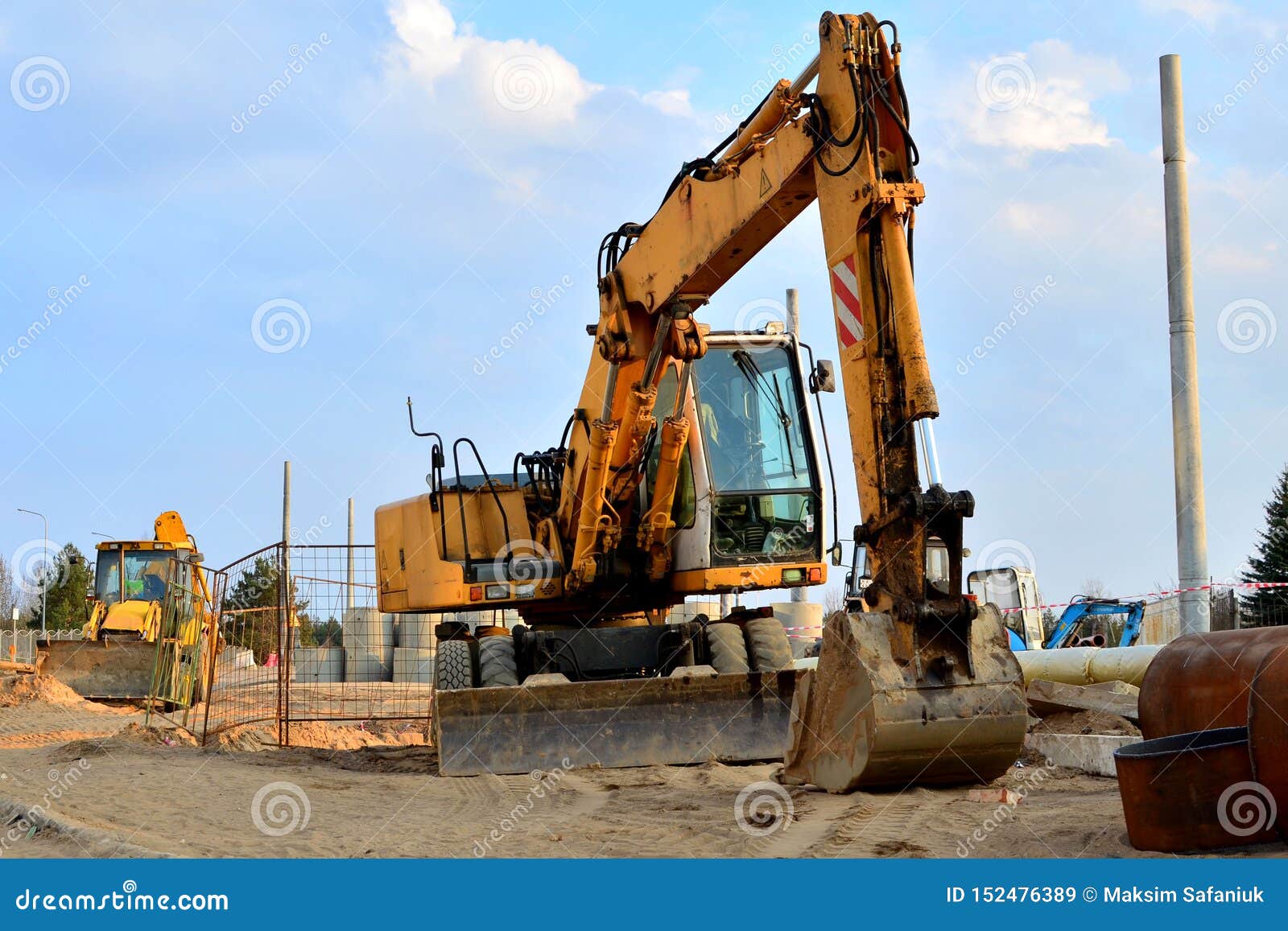 A Heavy Excavator in Working at Construction Site. Special Heavy ...