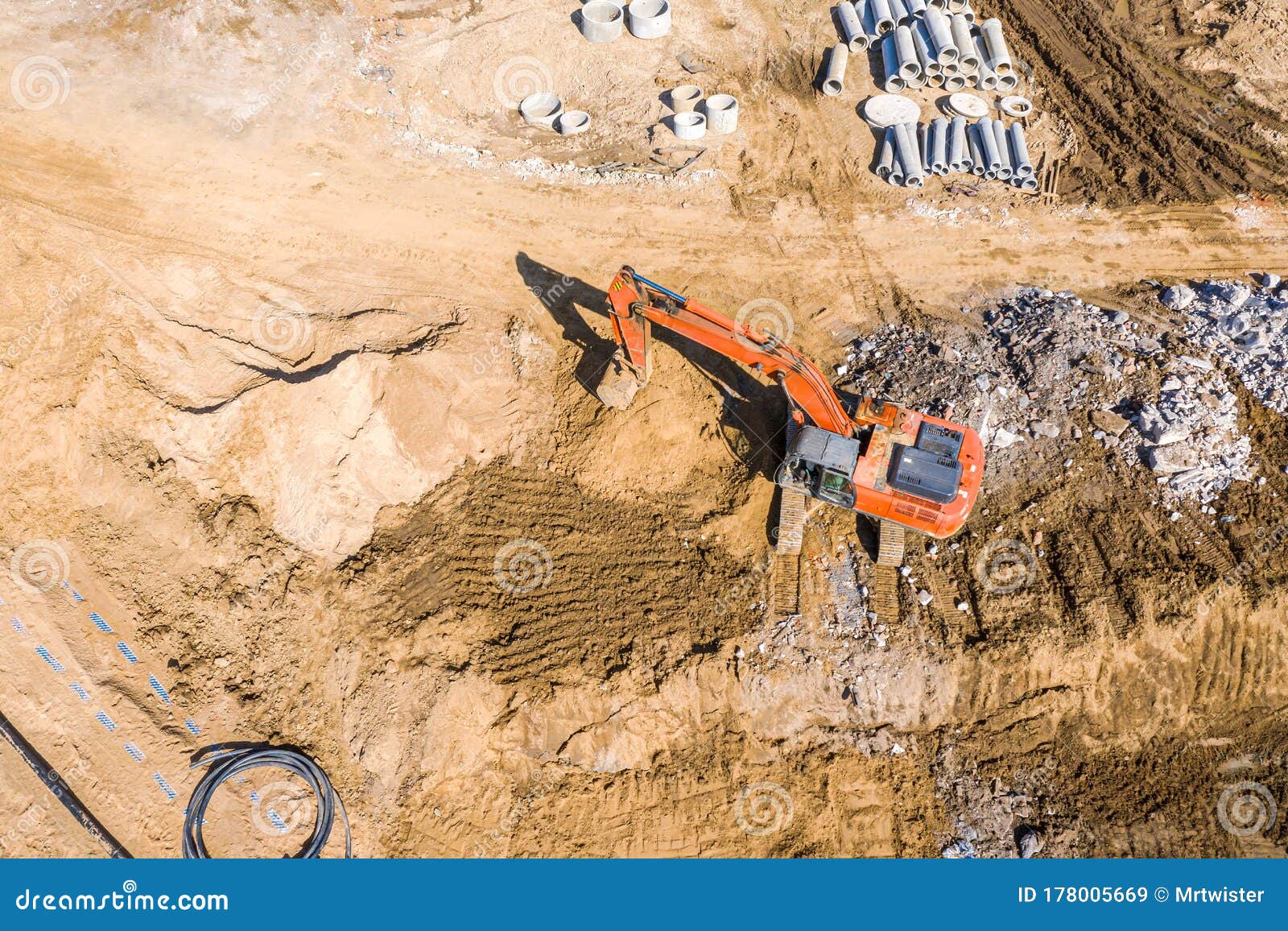 Heavy Excavator Working at Ground in Construction Site. Aerial View ...