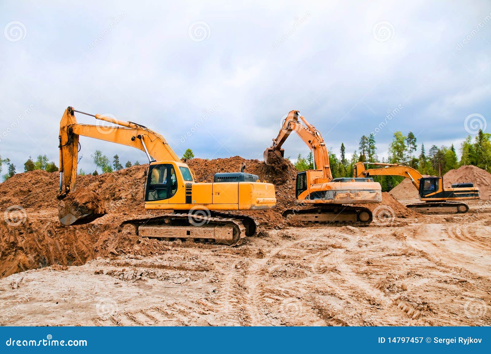 Three Excavators On Caterpillars In The Foundation Pit During The ...
