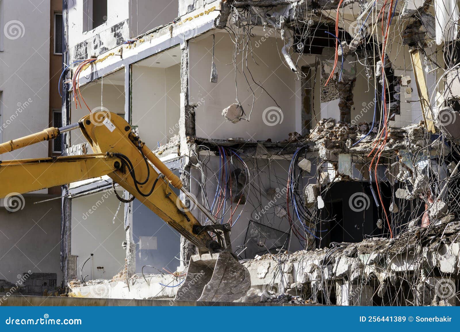 A Heavy Industrial Work Machine, Digger is Destroying an Abandoned Old ...