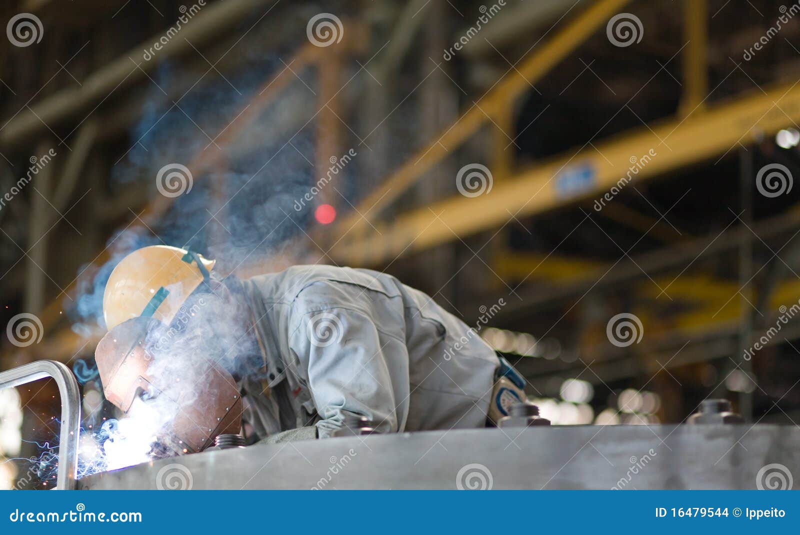 Heavy Industry Manual Worker Welding/grinding in a Stock Photo - Image ...