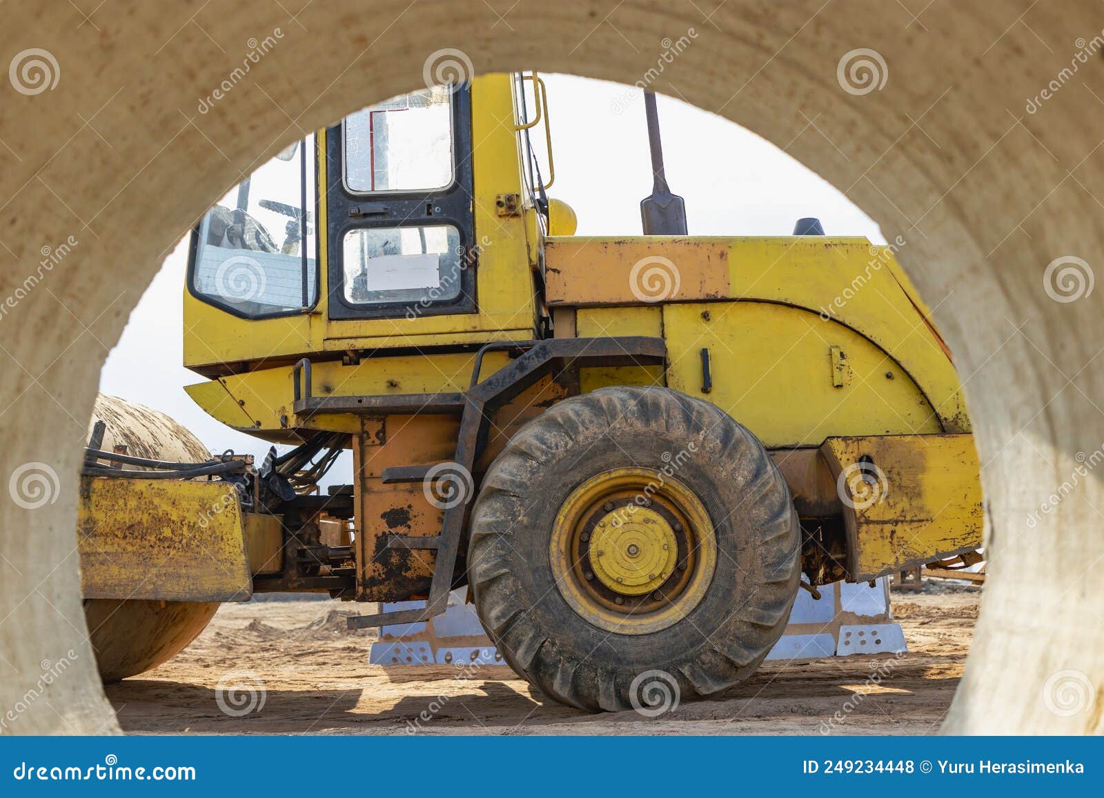 Heavy Loader at the Construction Site. View of the Wheel Loader through ...