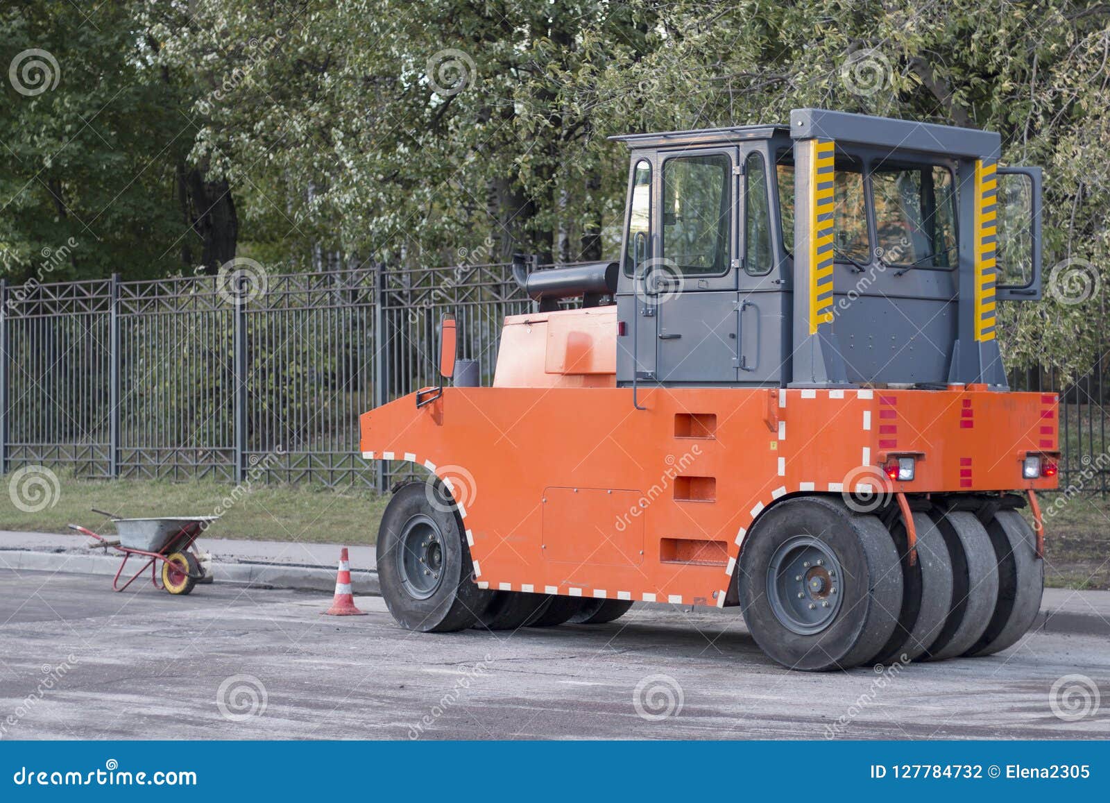 Heavy Machinery Against Hand Tools Stock Photo - Image of street ...