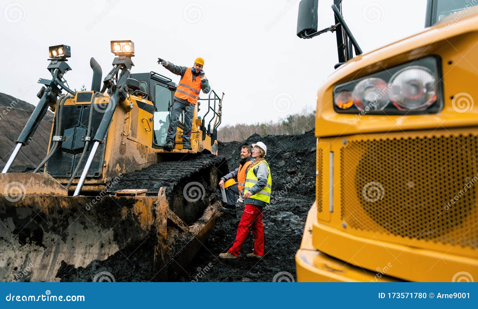Heavy Machinery and Workers in Pit of Quarry Stock Photo - Image of ...
