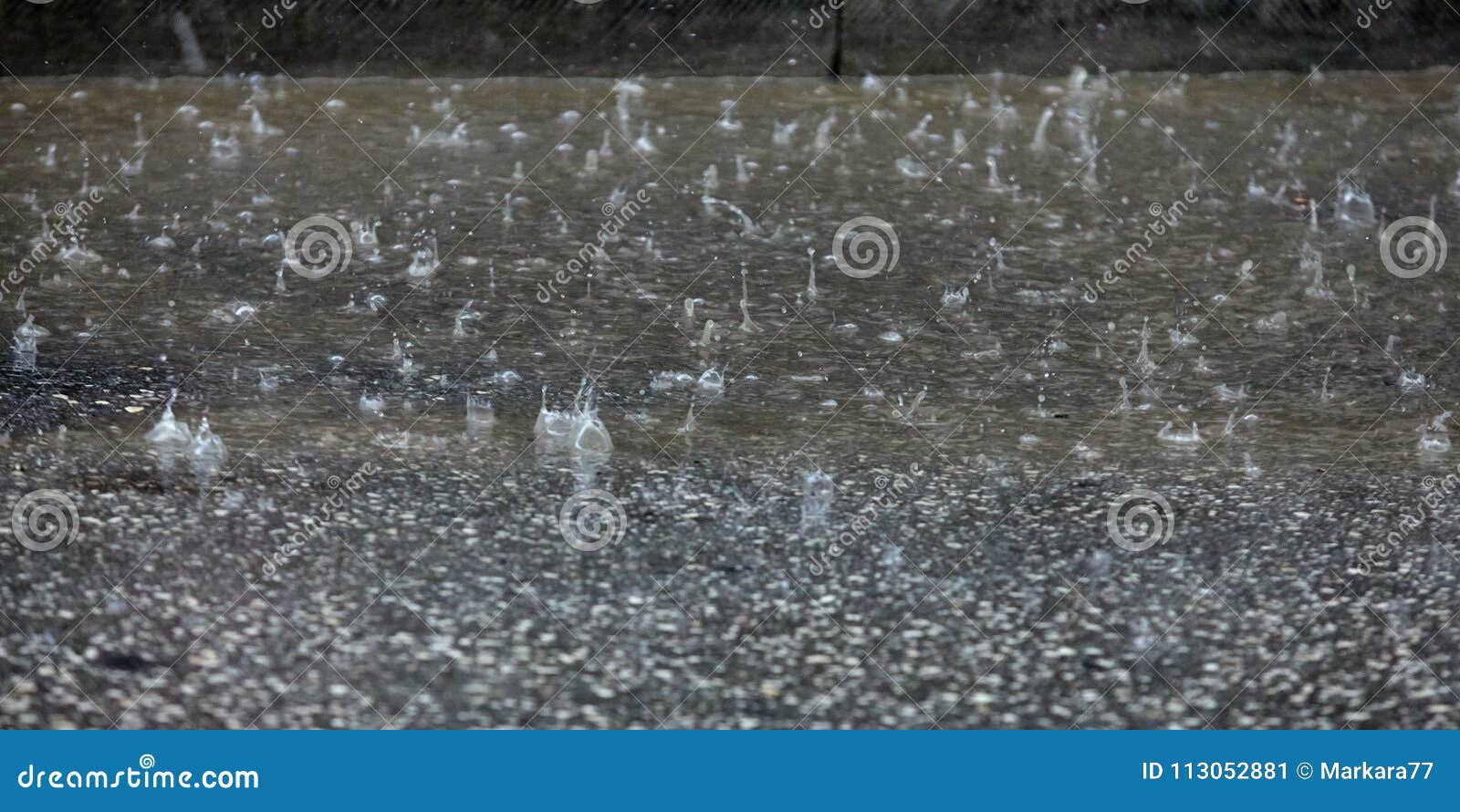 Heavy rain drops on road. stock image. Image of drop - 113052881