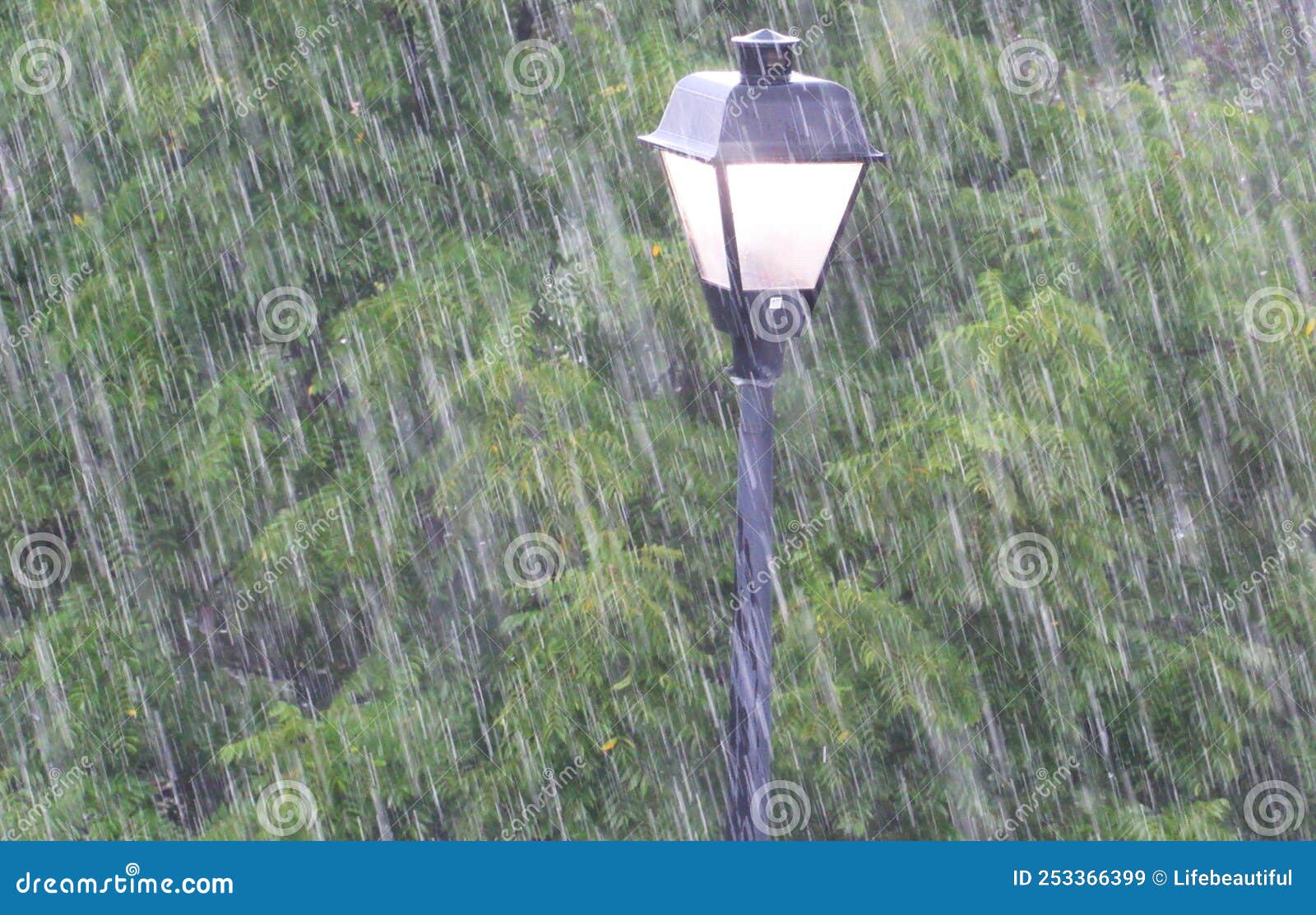 Heavy rain and lamp post stock image. Image of lamp - 253366399