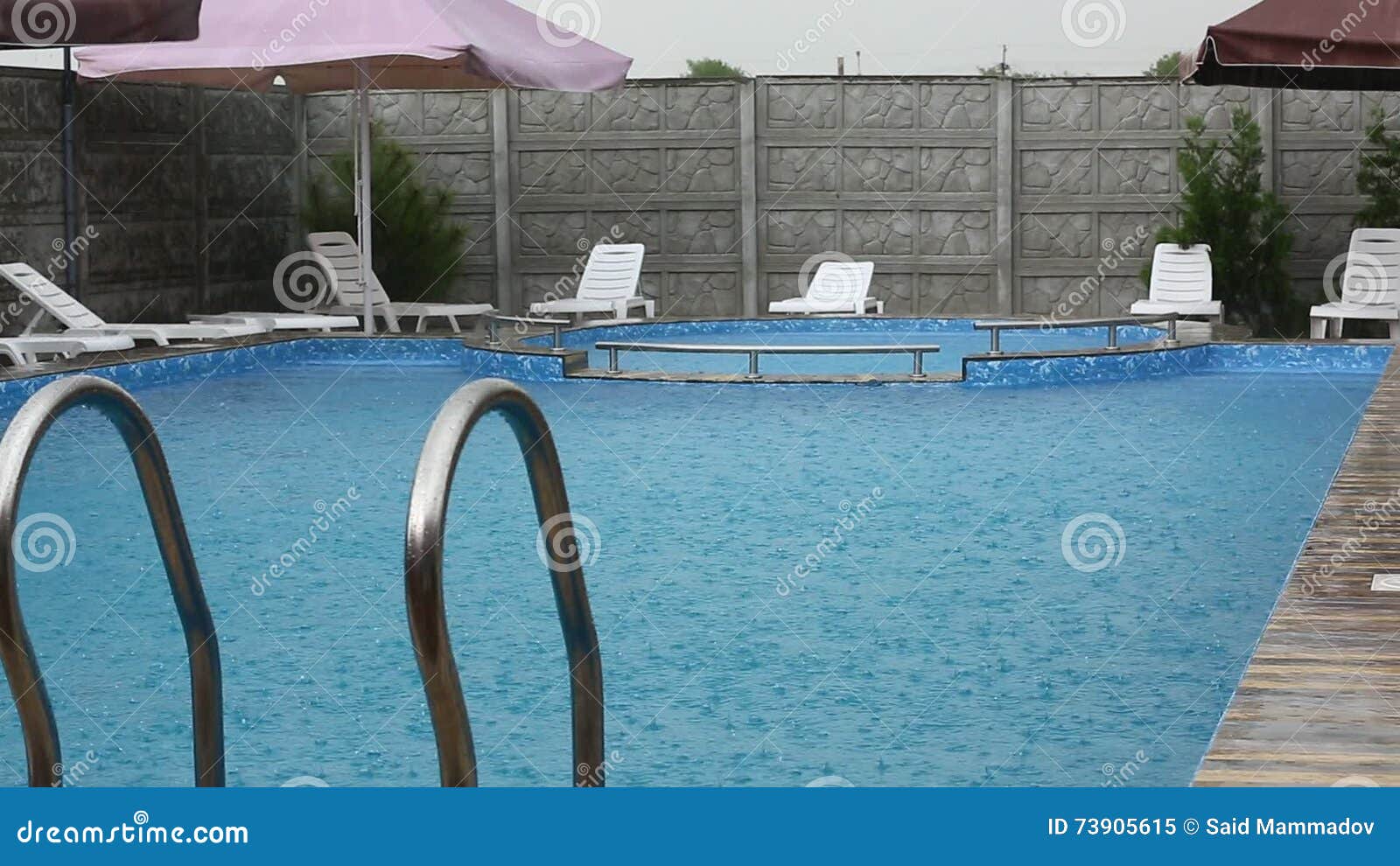 Heavy Rain Falls into a Swimming Pool. Stock Video - Video of outdoors ...