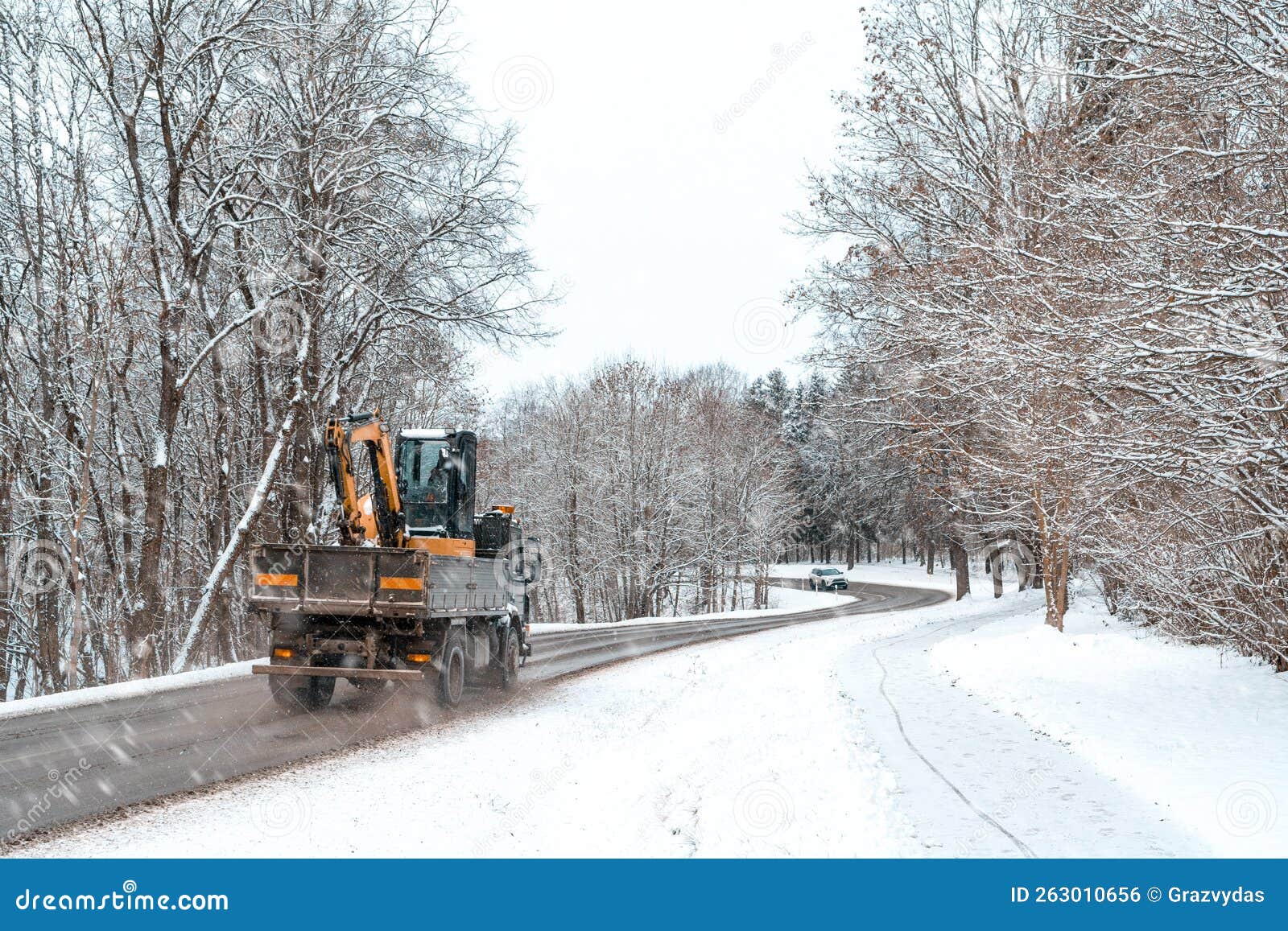 Heavy Transport Passing on a Highway with Snow Slush and Snow Fall ...