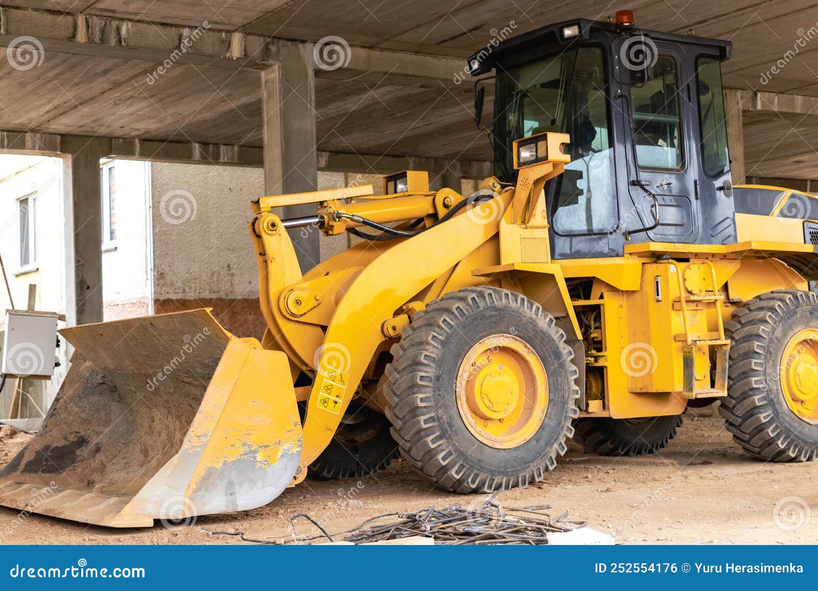 Heavy Wheel Loader With A Bucket At A Construction Site. Equipment For ...