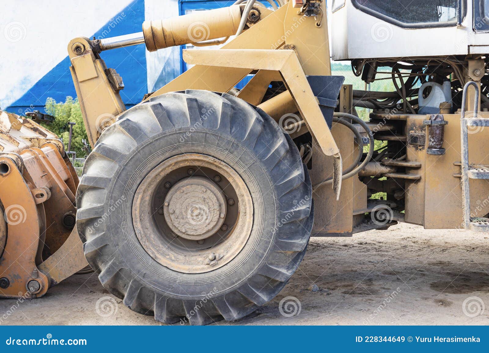 Heavy Wheel Loader With A Bucket At A Construction Site. Equipment For ...