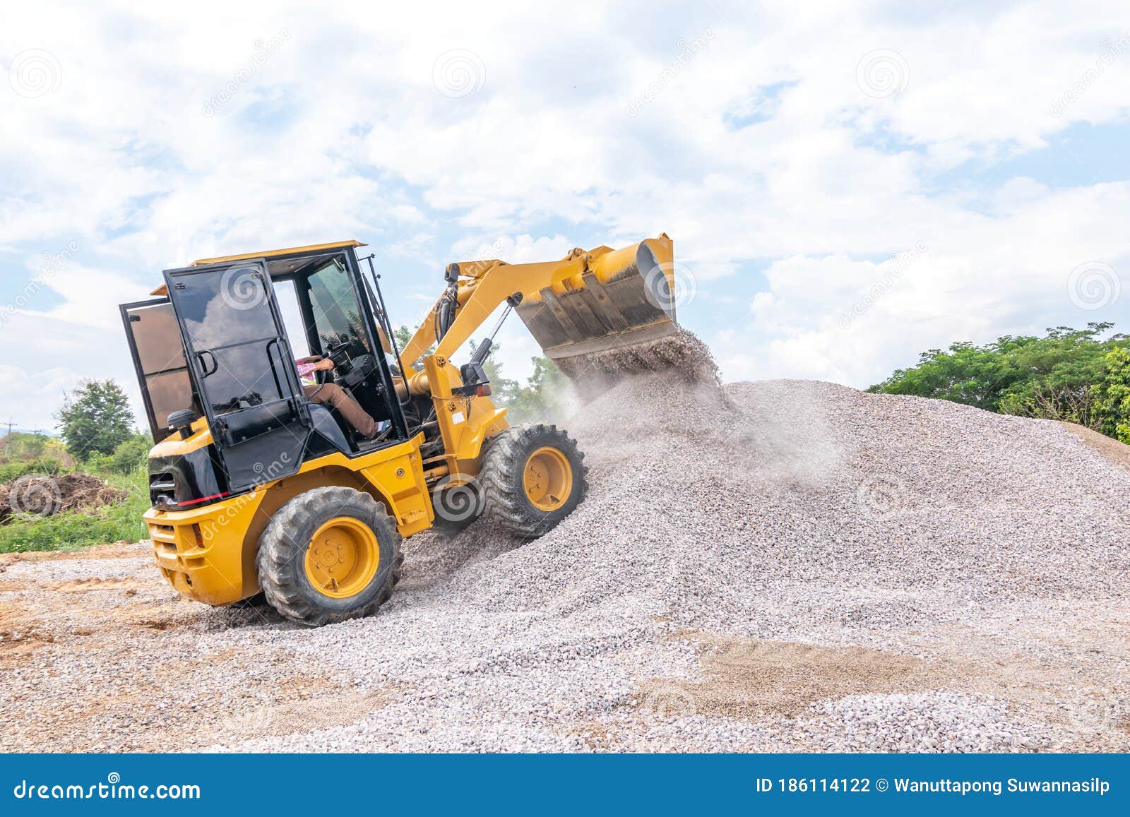 Heavy Yellow Bulldozer on Construction. Wheel Loader Machine Unloading ...