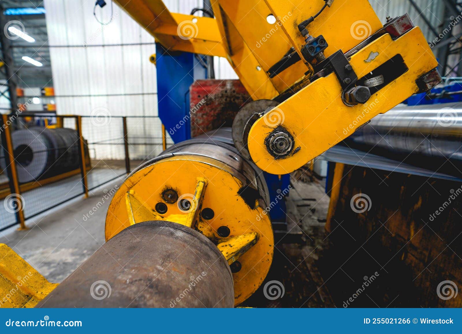 Heavy Yellow Machinery Working in a Factory Stock Photo - Image of ...