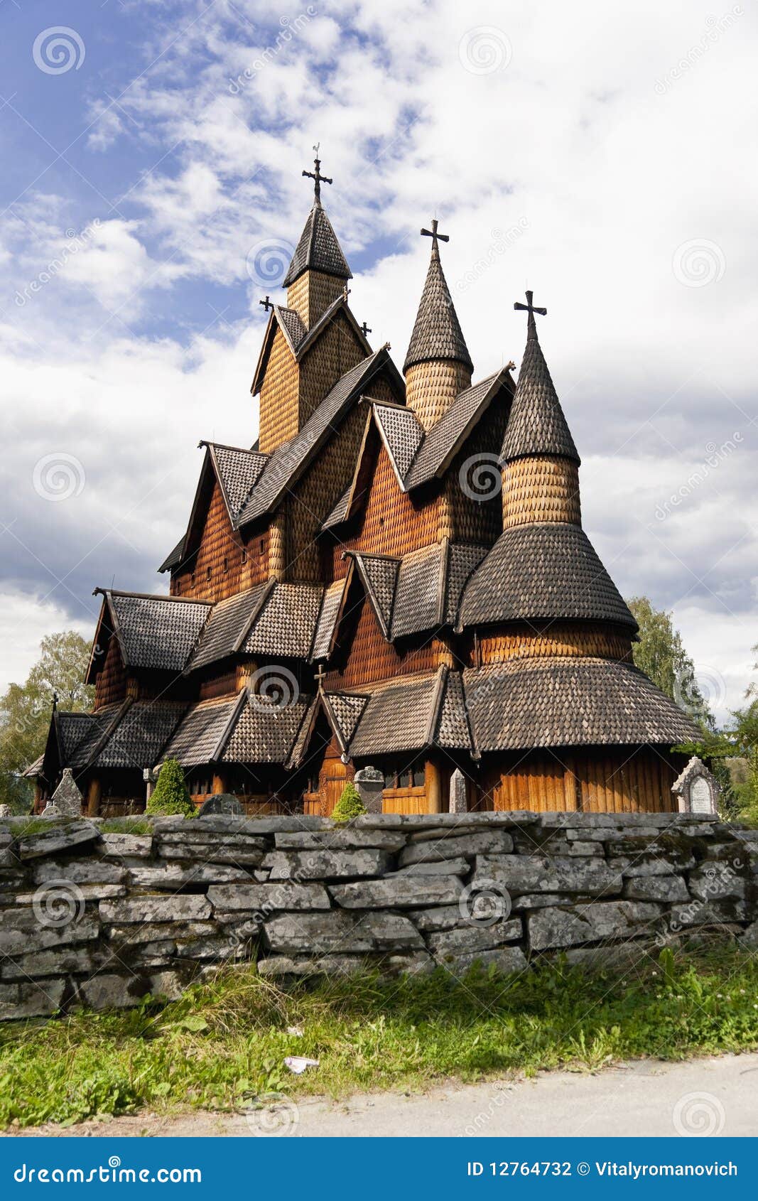 Old Stave Church With Intricate Staves Against White Snowy Sky And Snow ...
