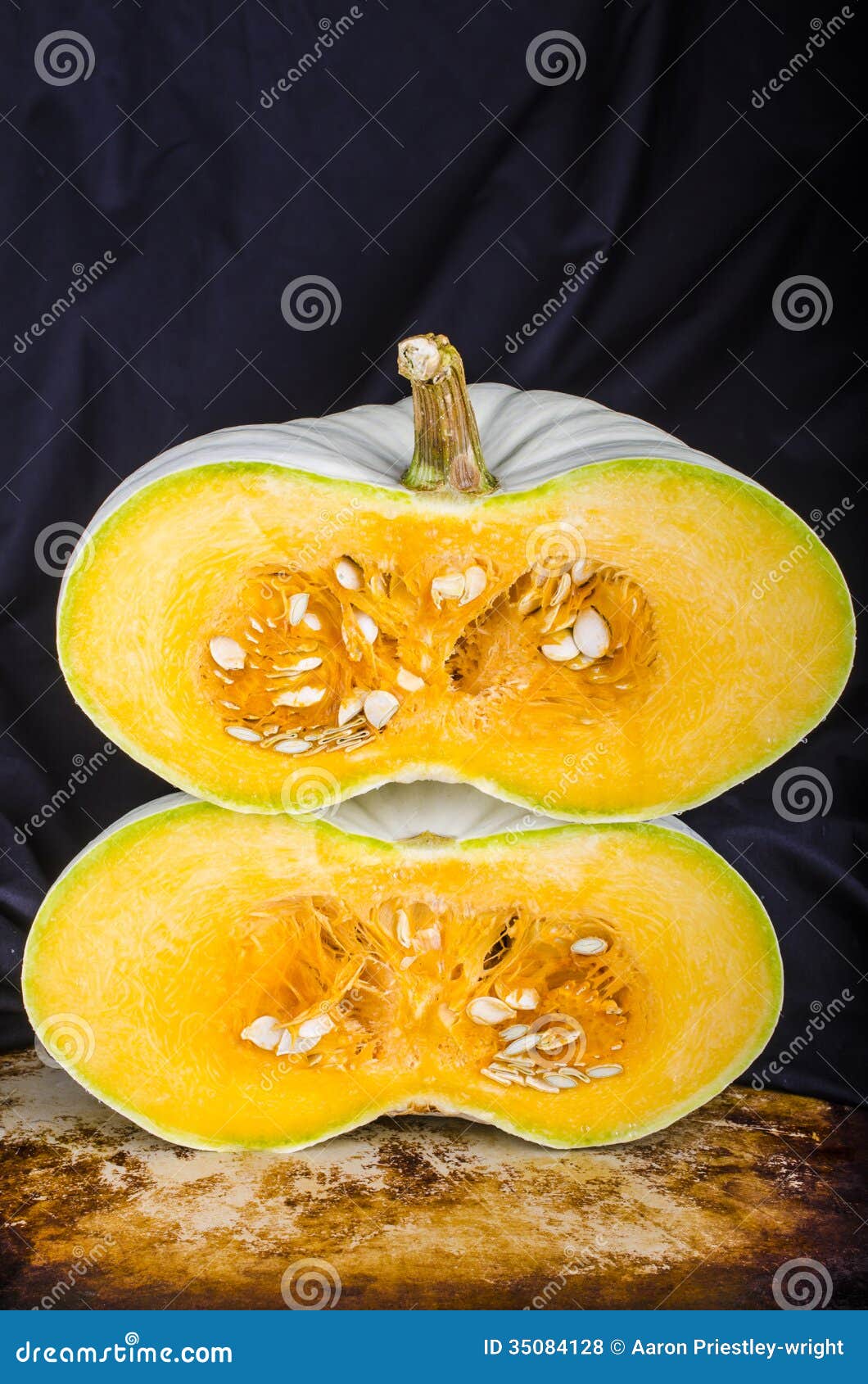 Heirloom Pumpkin Stacked Halves on Black Stock Photo - Image of ...