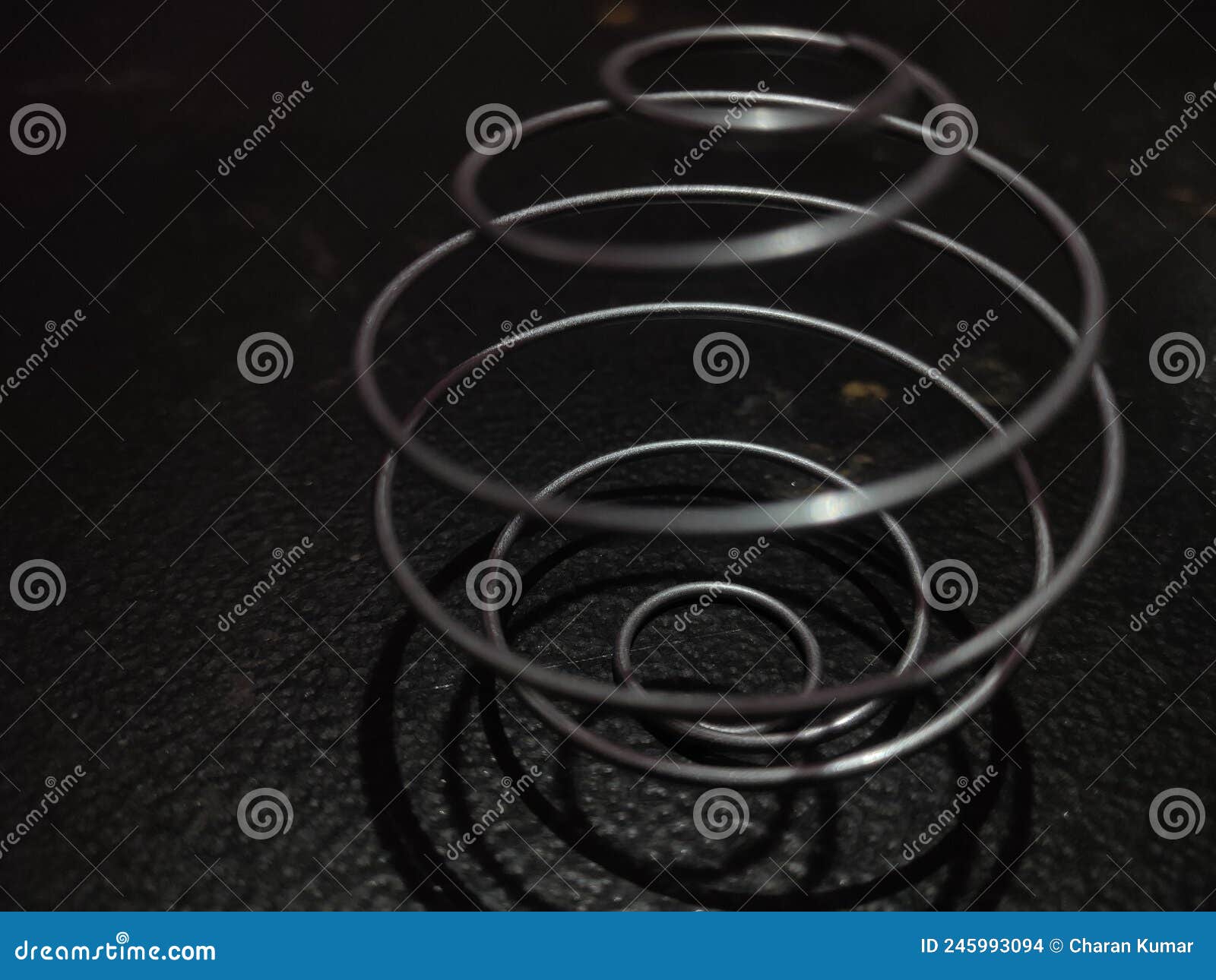 Helical spring shaker dark stock photo. Image of lighting - 245993094