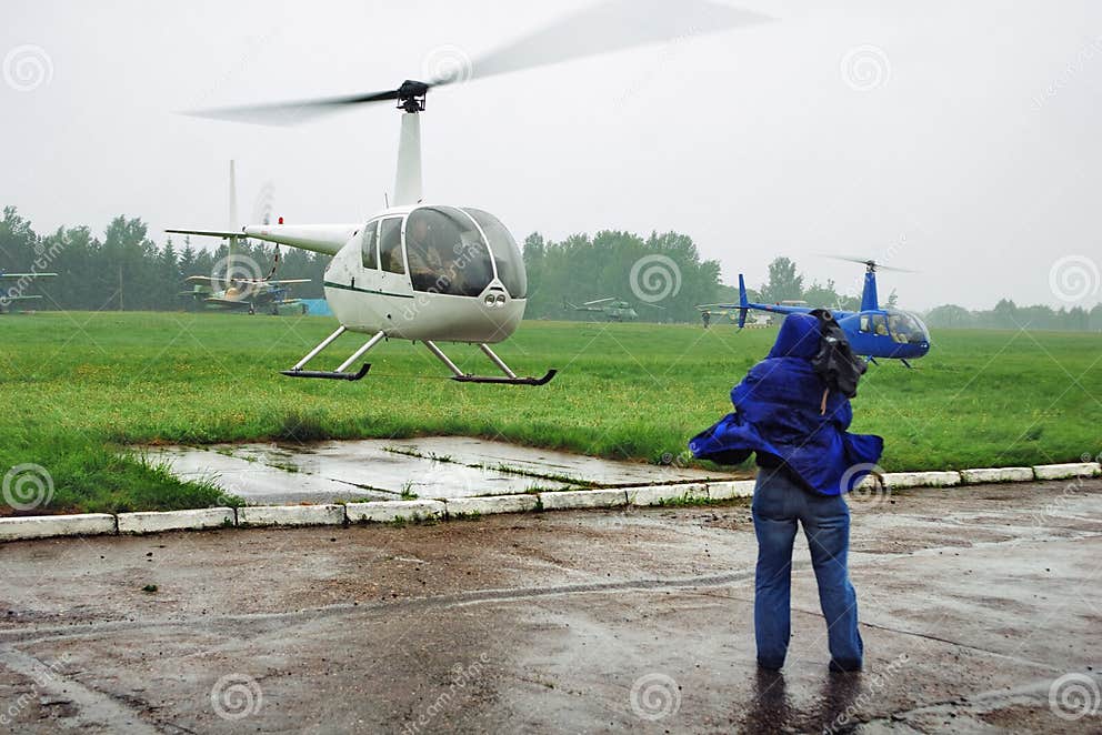 Helicopter and cameraman stock photo. Image of umbrella - 15525260