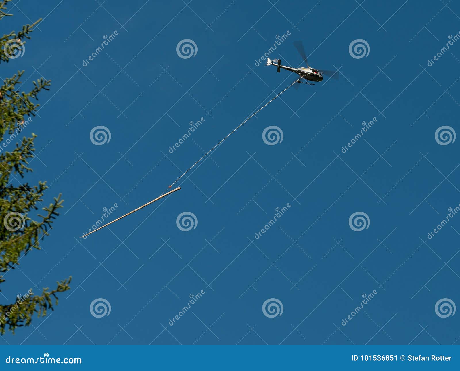 A Helicopter Carrying a Tree Trunk Blue Sky Stock Image - Image of ...