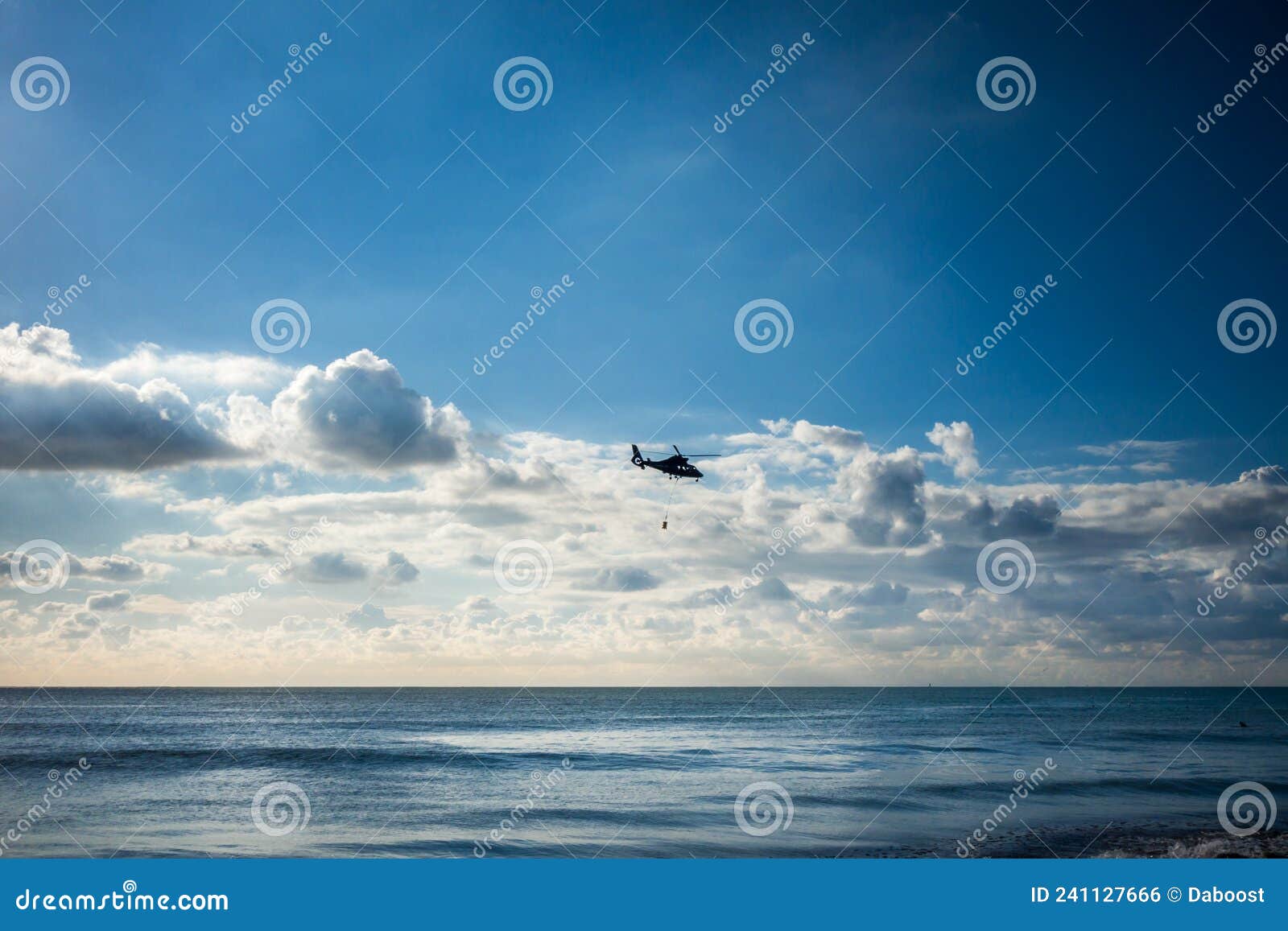 Helicopter on a Cloudy Seascape View from a Beach Stock Photo - Image ...