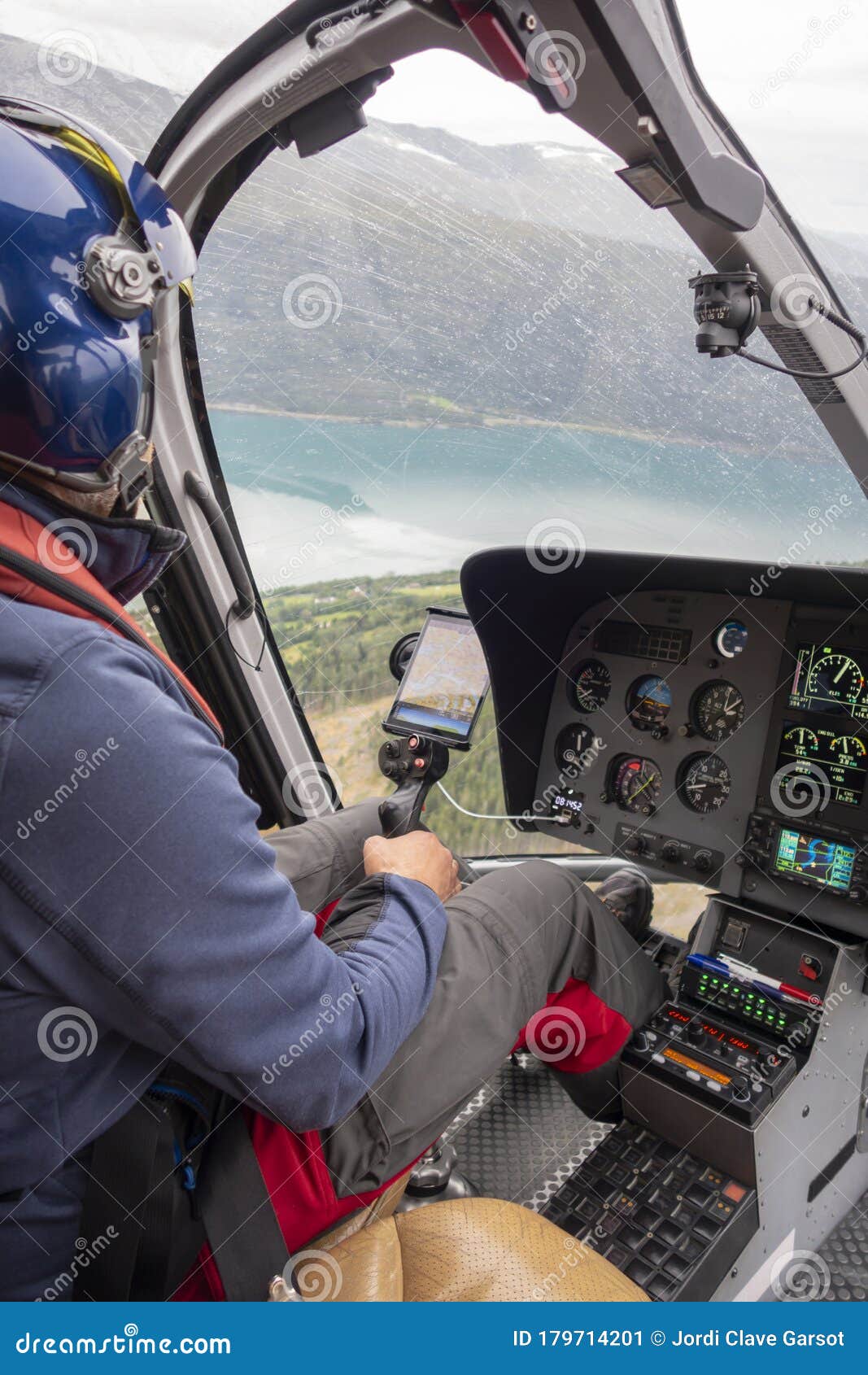 Helicopter Cockpit with Pilot Flying Editorial Photo - Image of rain ...