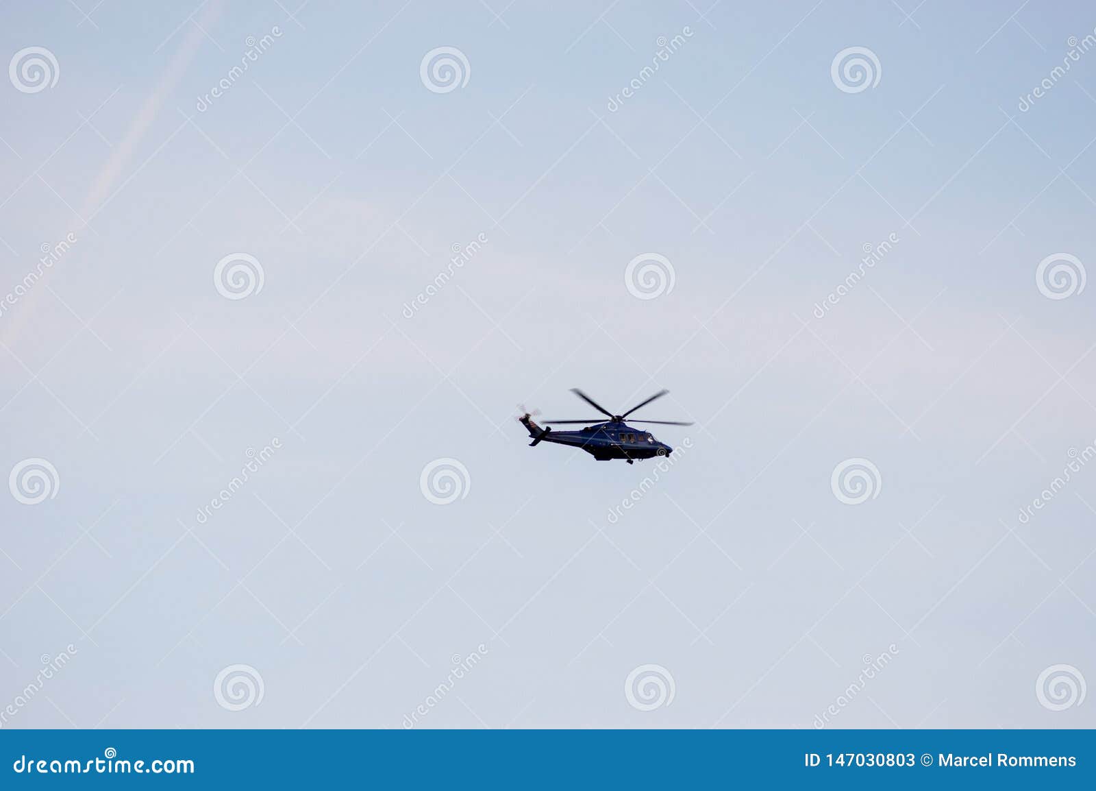 Helicopter in the distance stock image. Image of pilot - 147030803