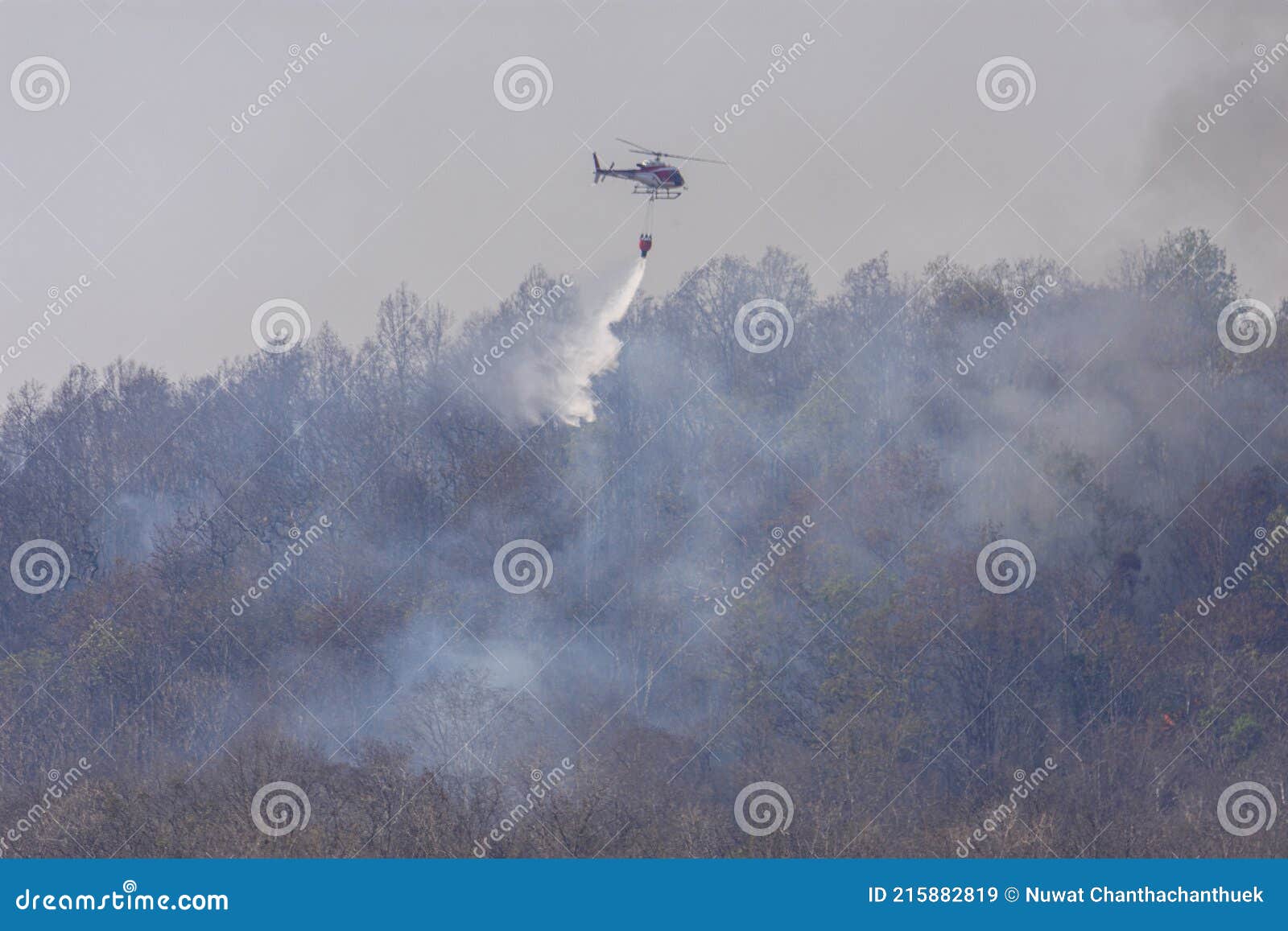 Helicopter Dropping Water on a Forest Fire Stock Image - Image of ...