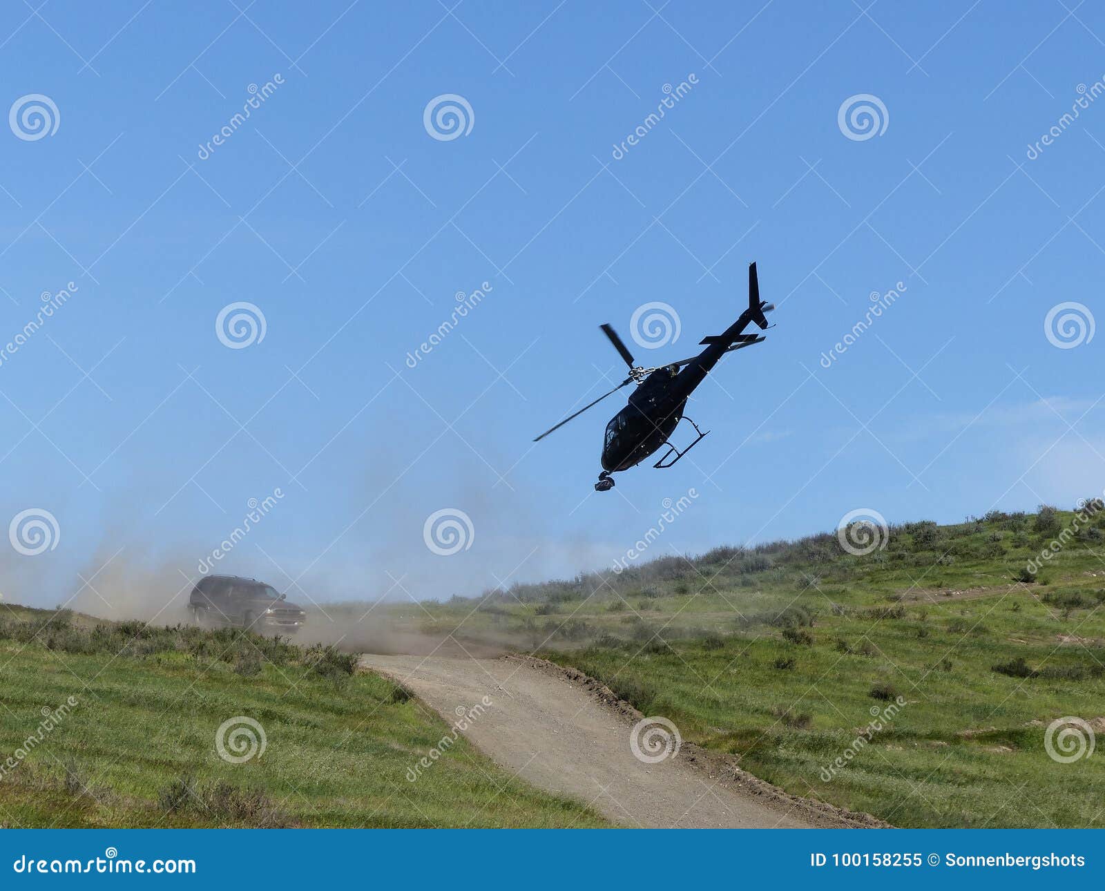 Helicopter Filming Stunt Car Chase Stock Image - Image of camera ...