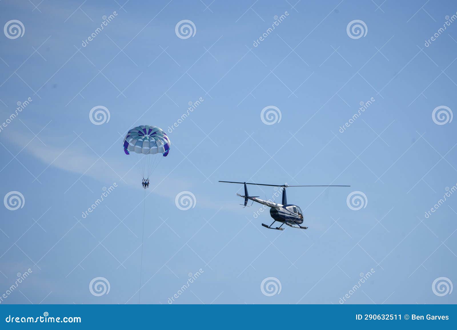 Helicopter Passes Towed Parasail Editorial Photo - Image of helicopter ...