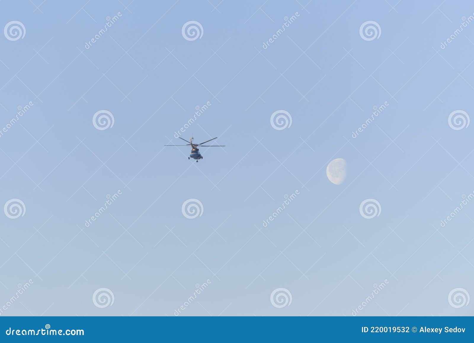 Helicopter Flying in the Blue Sky with Moon Stock Photo - Image of ...