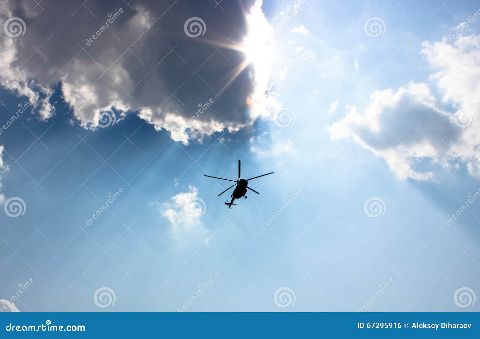 Helicopter Flying in the Sky among the Rays of the Sun Stock Photo ...